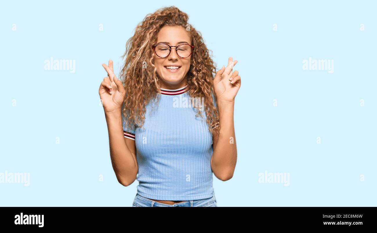 Beautiful caucasian teenager girl wearing casual clothes and glasses ...