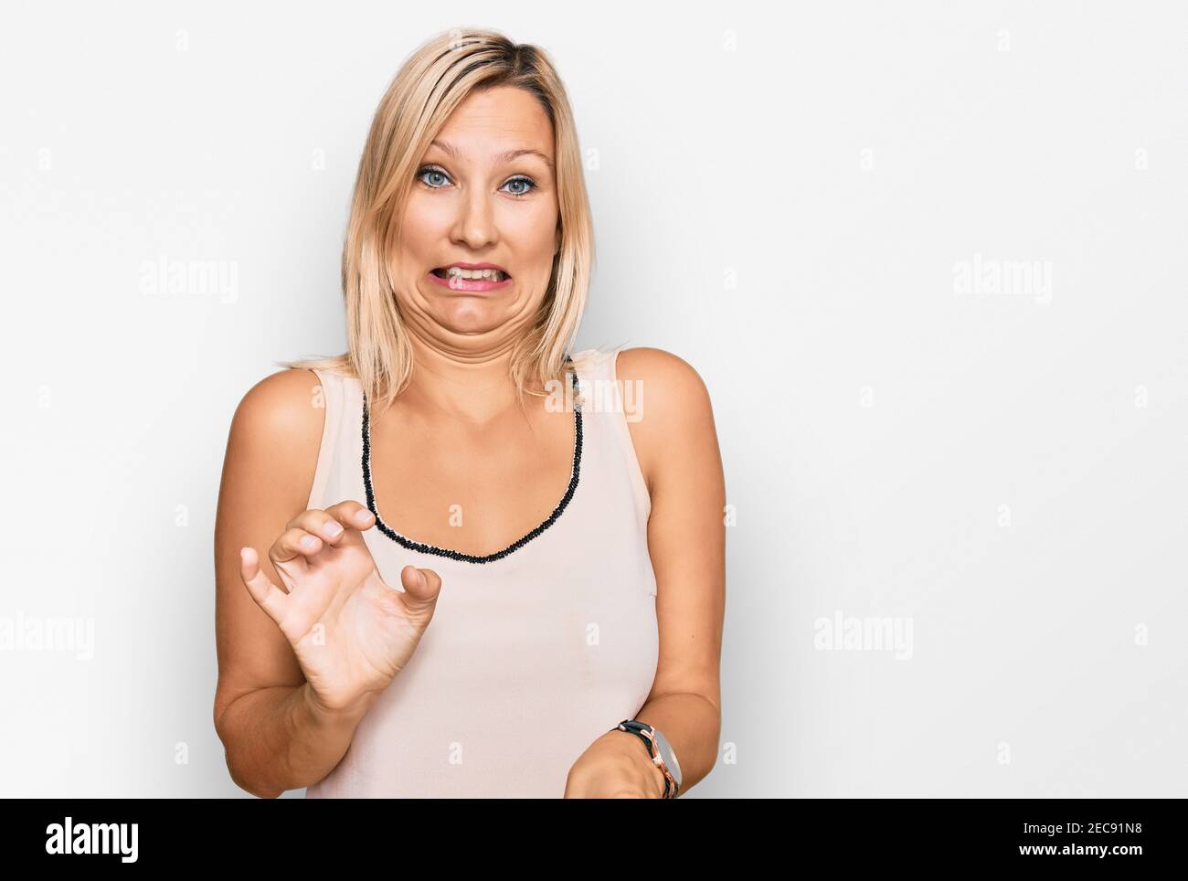 Middle age caucasian woman wearing casual clothes disgusted expression ...