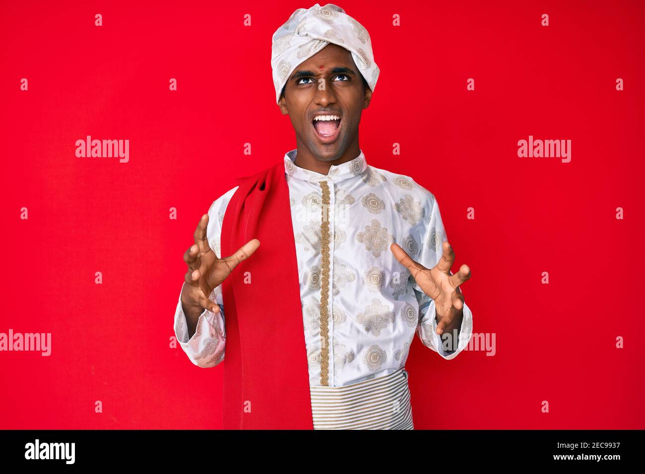 Handsome indian man wearing tradition sherwani saree clothes crazy and ...