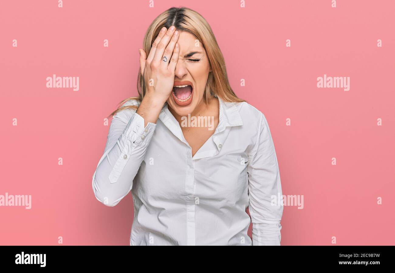 Young caucasian woman wearing casual clothes yawning tired covering ...