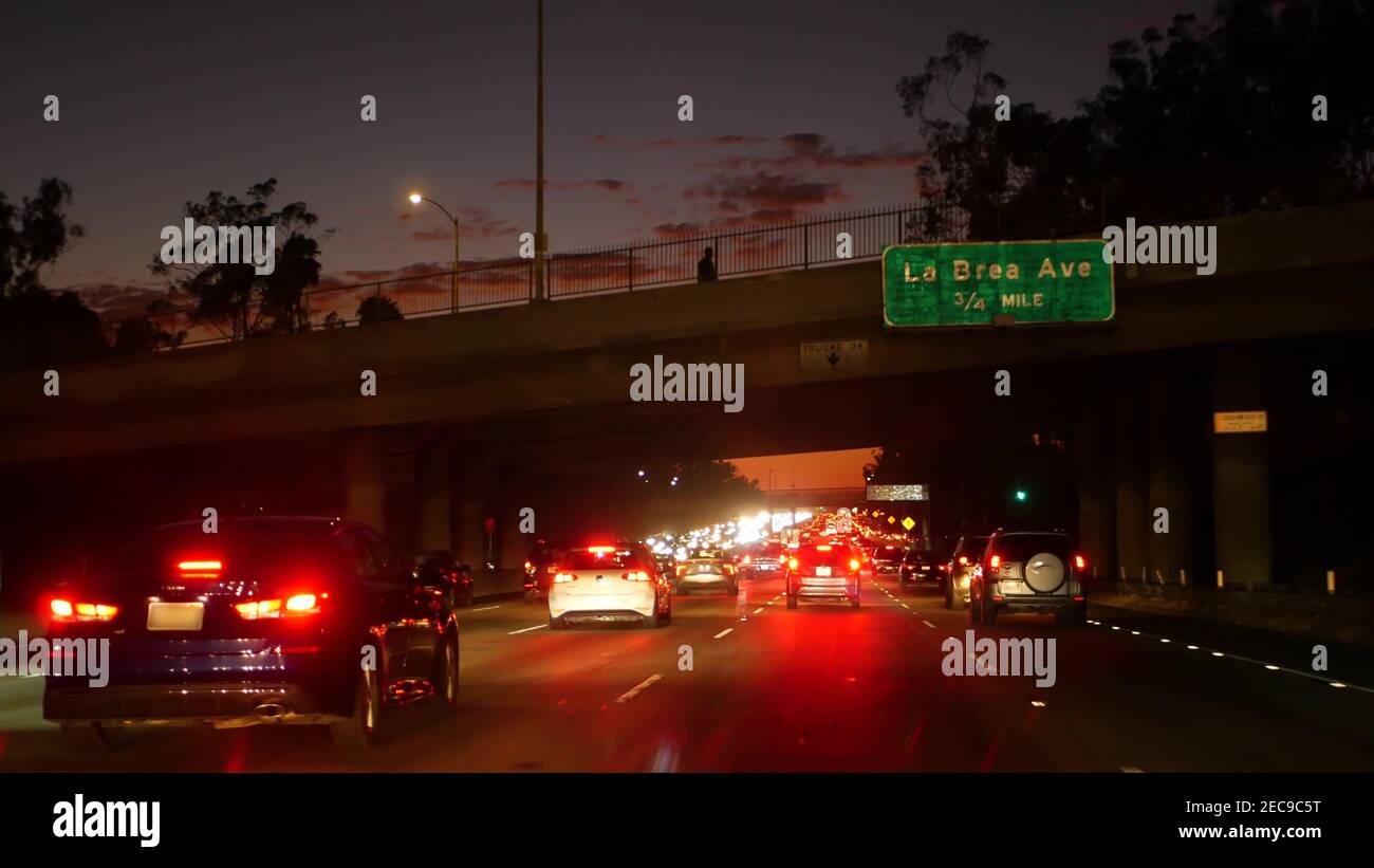 View from the car. Los Angeles busy freeway at night time. Massive ...