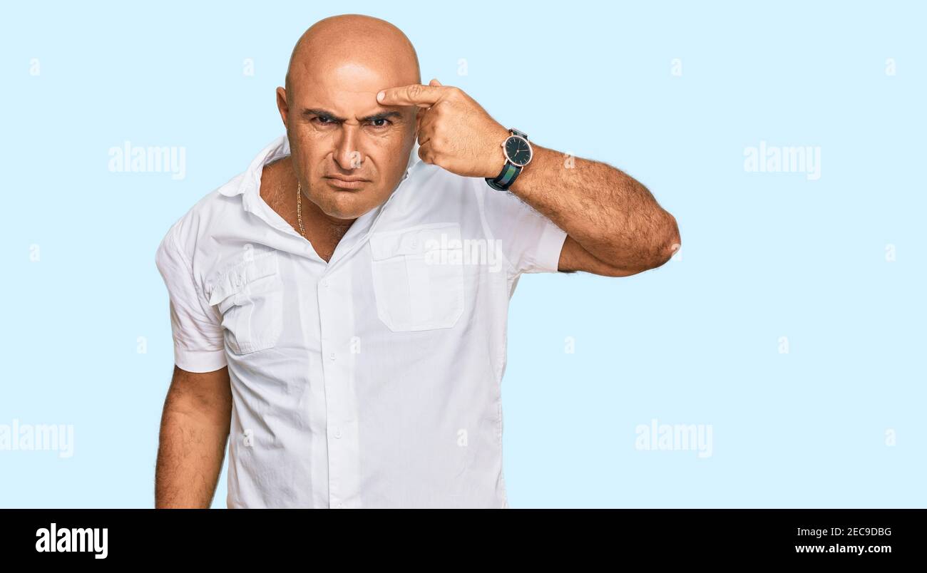 Mature middle east man with mustache wearing casual white shirt ...