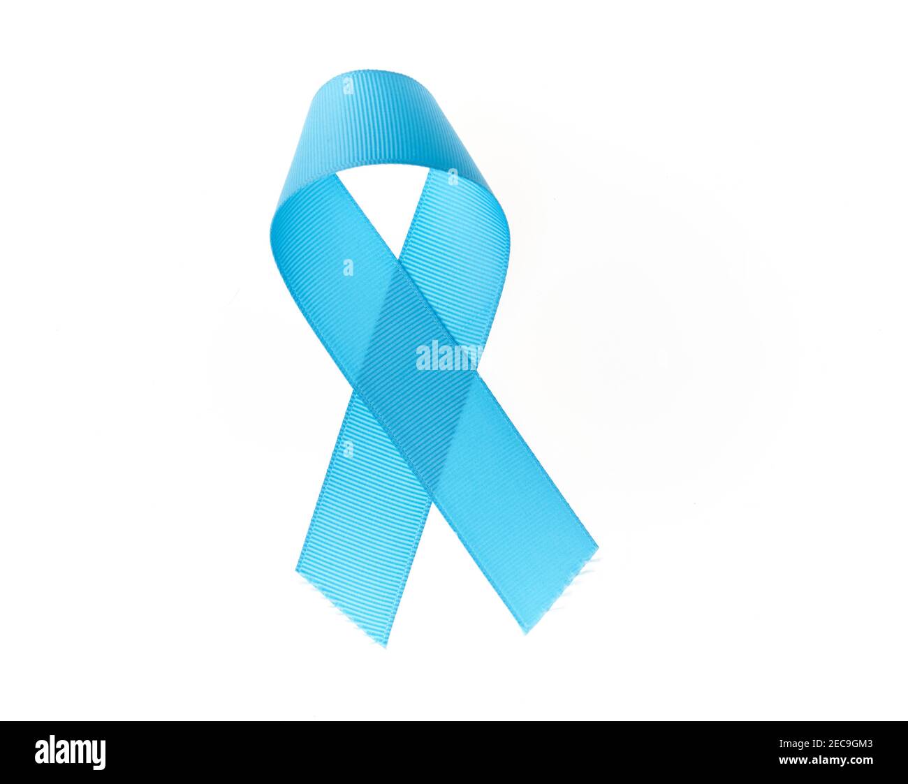 Awareness blue ribbon over isolated white background Stock Photo - Alamy
