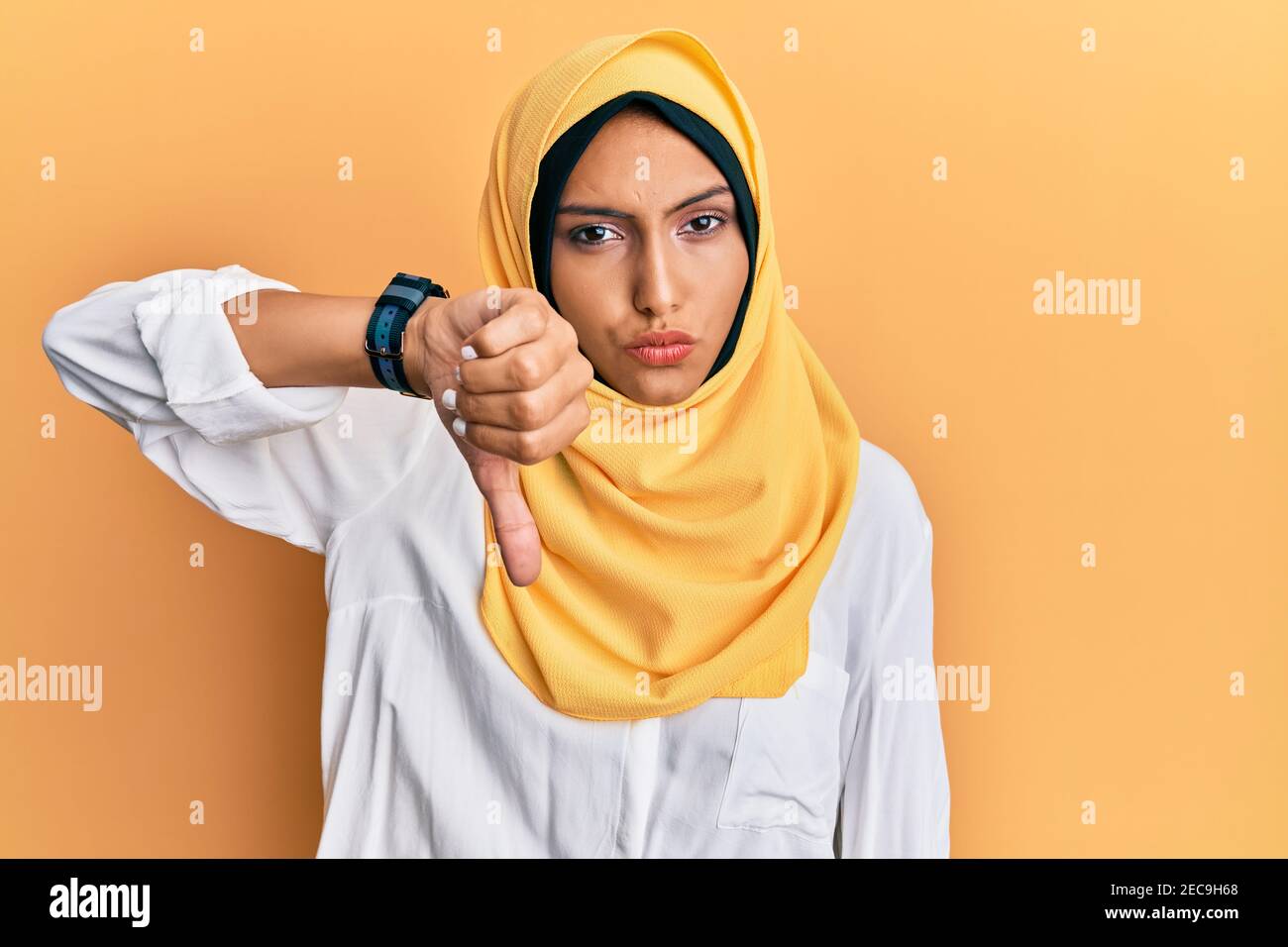 Young brunette arab woman wearing traditional islamic hijab scarf ...