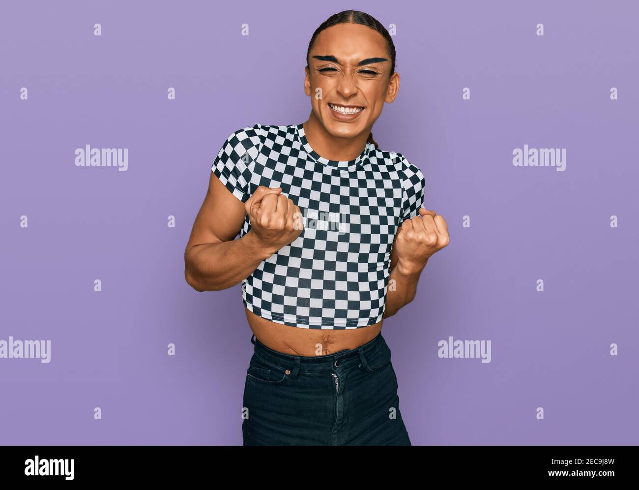 Hispanic transgender man wearing make up and long hair wearing modern ...