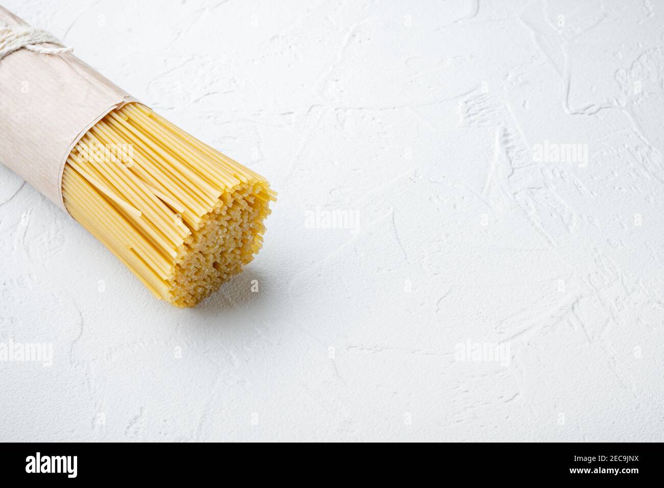Long spaghetti. Raw spaghetti set, on white background , with copyspace ...