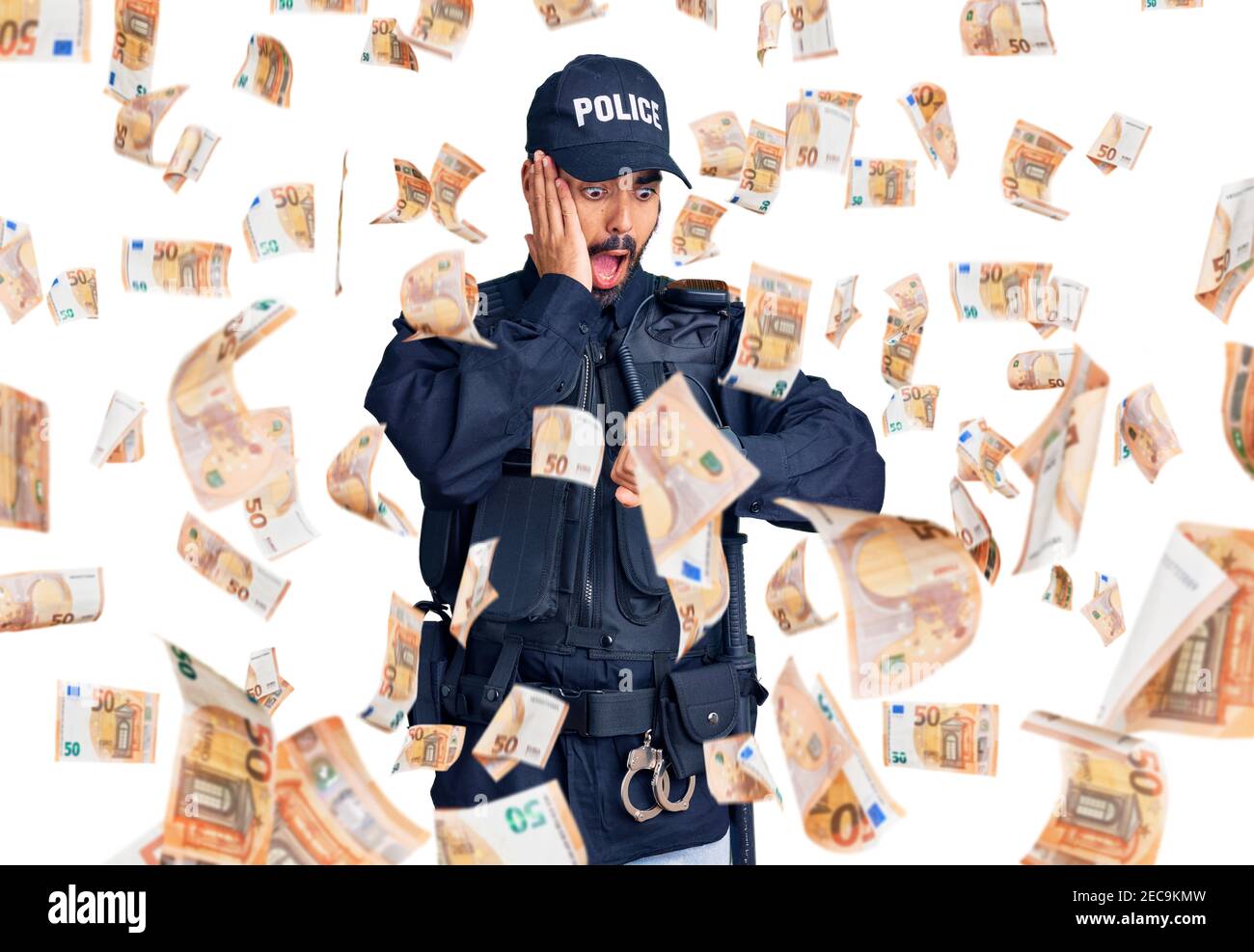 Young hispanic man wearing police uniform looking at the watch time ...