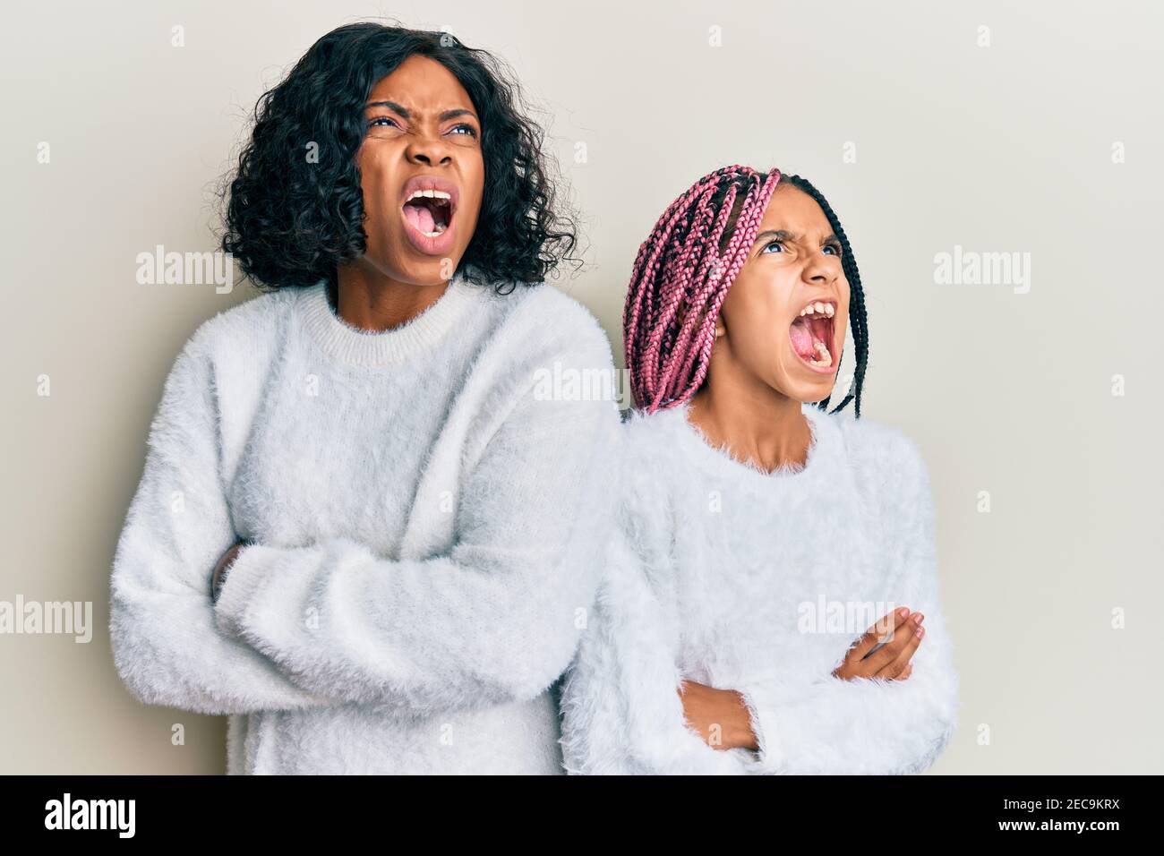 Beautiful African American Mother And Daughter With Arms Crossed Gesture Angry And Mad Screaming