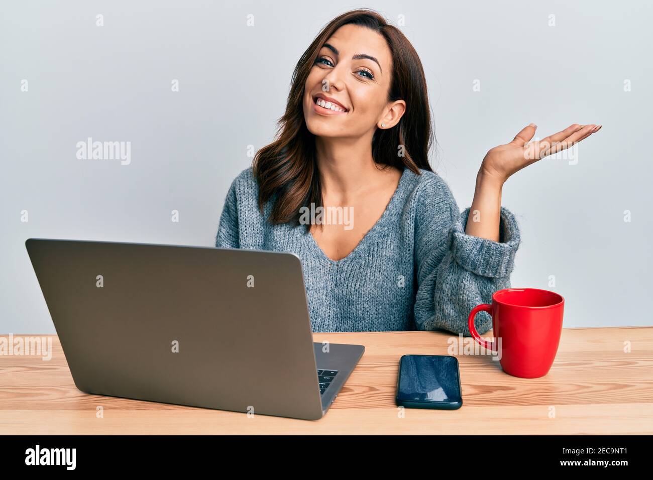 Young brunette woman working at the office using computer laptop ...