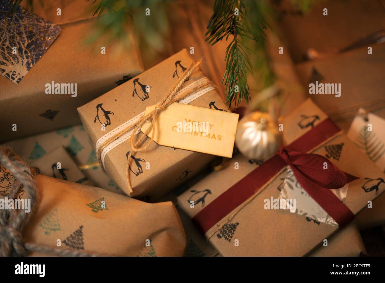 Top view of Christmas gift boxes under the tree and bright lights with ...