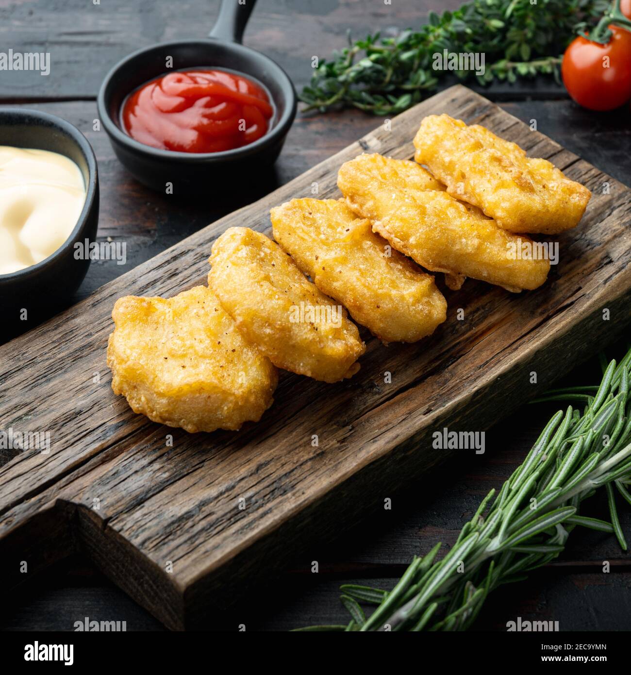 Fried crispy chicken nuggets meat on dark wooden background Stock Photo ...