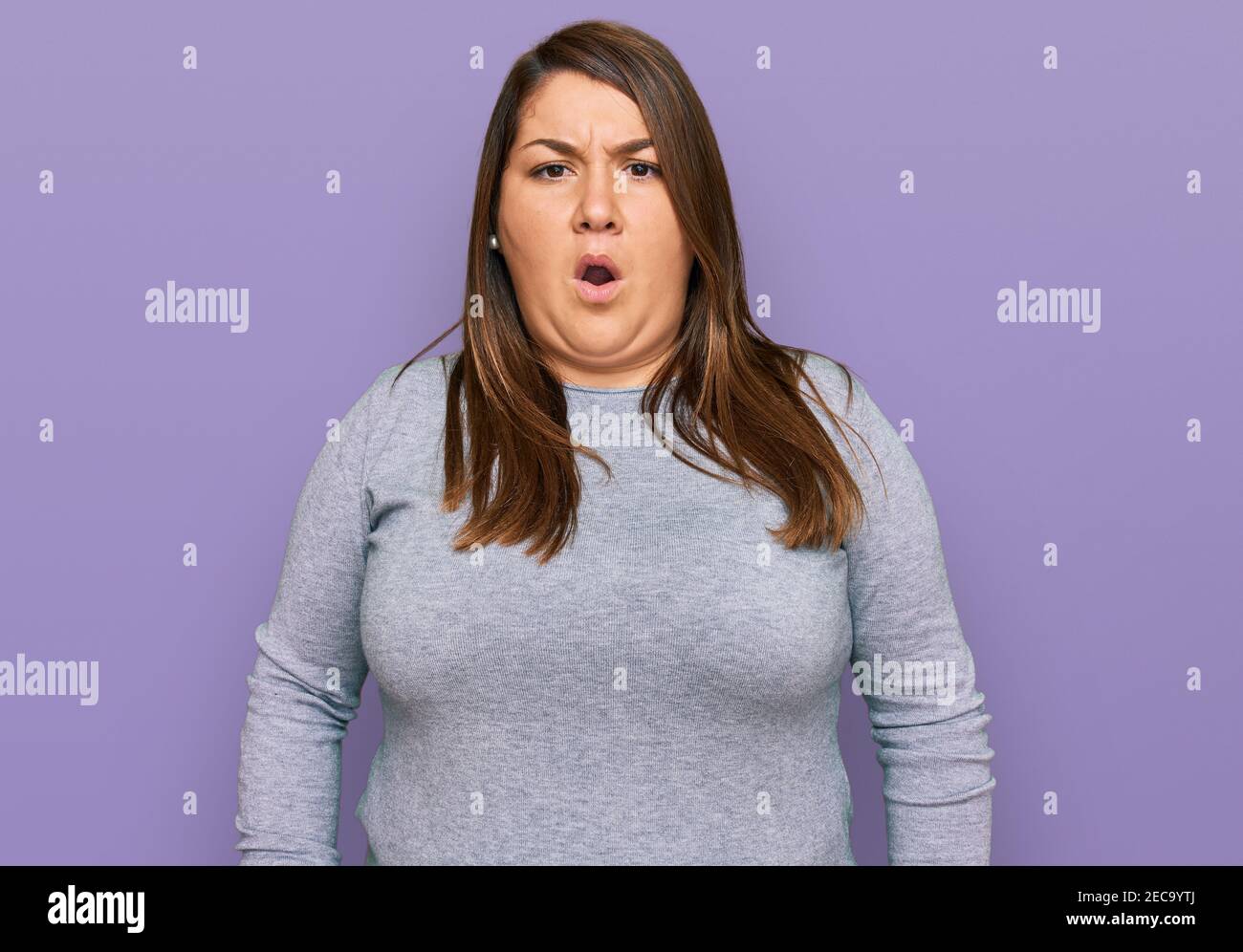 Beautiful Brunette Plus Size Woman Wearing Casual Clothes In Shock Face