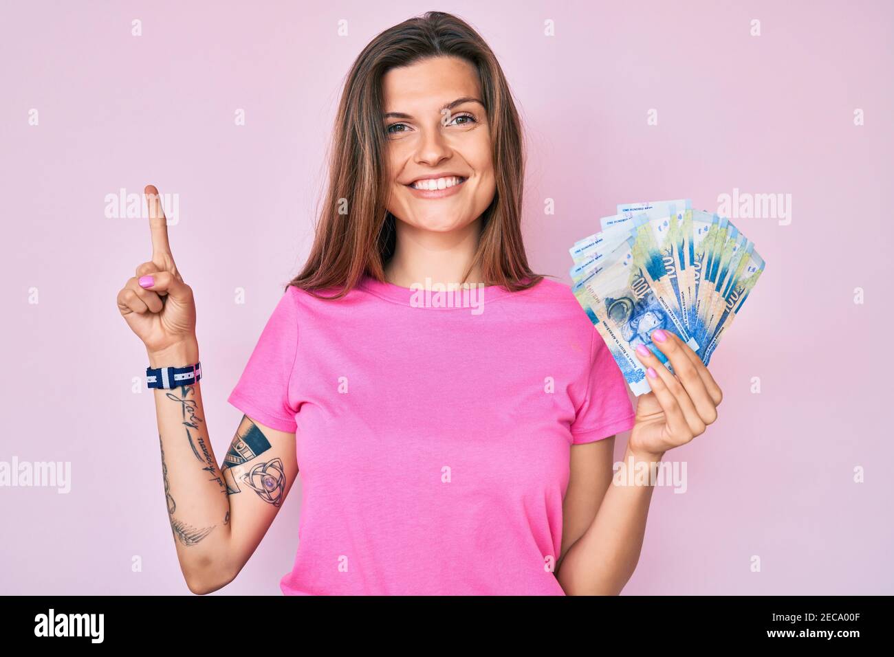 Beautiful caucasian woman holding south african rand banknotes smiling ...
