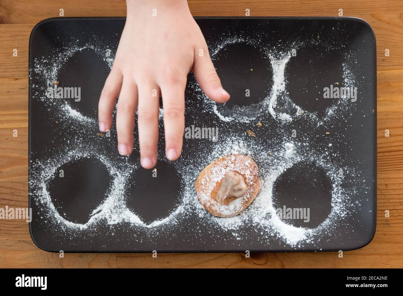 Child's hand reaching for last cookie on tray Stock Photo - Alamy