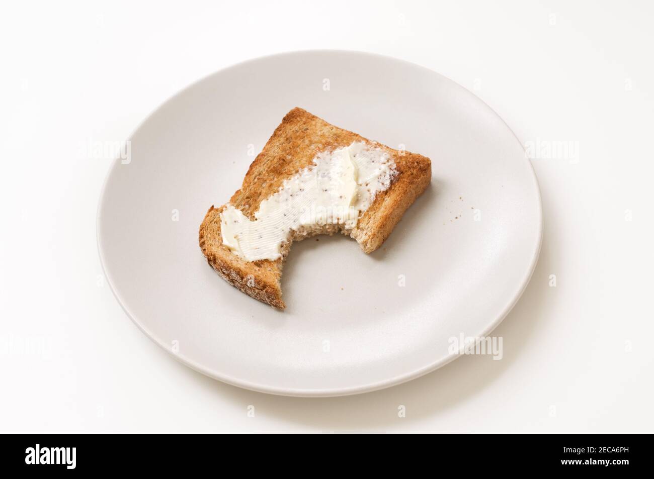 Breakfast toast with a bite taken out Stock Photo - Alamy