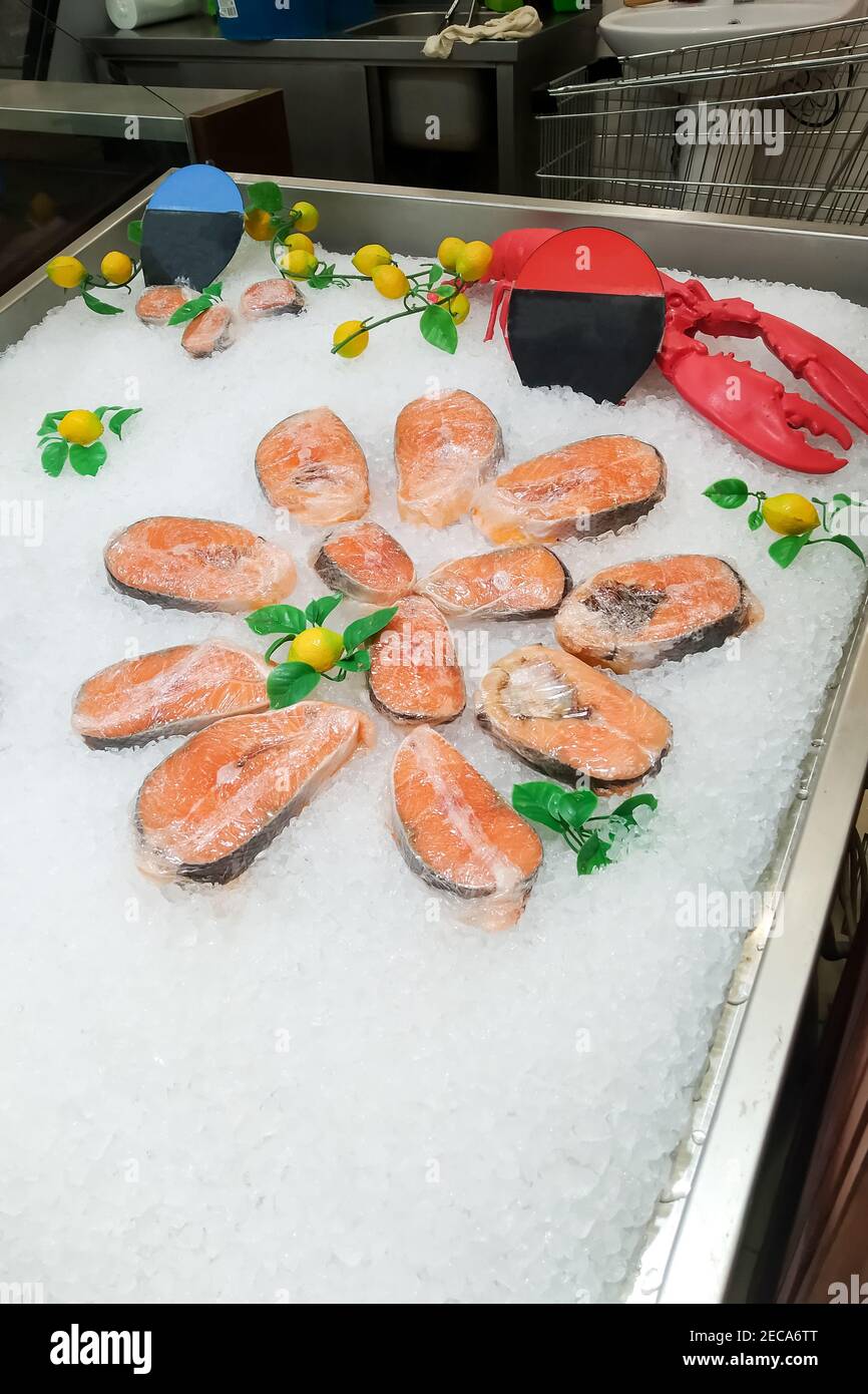 Pieces of red fish on a shop window Stock Photo - Alamy