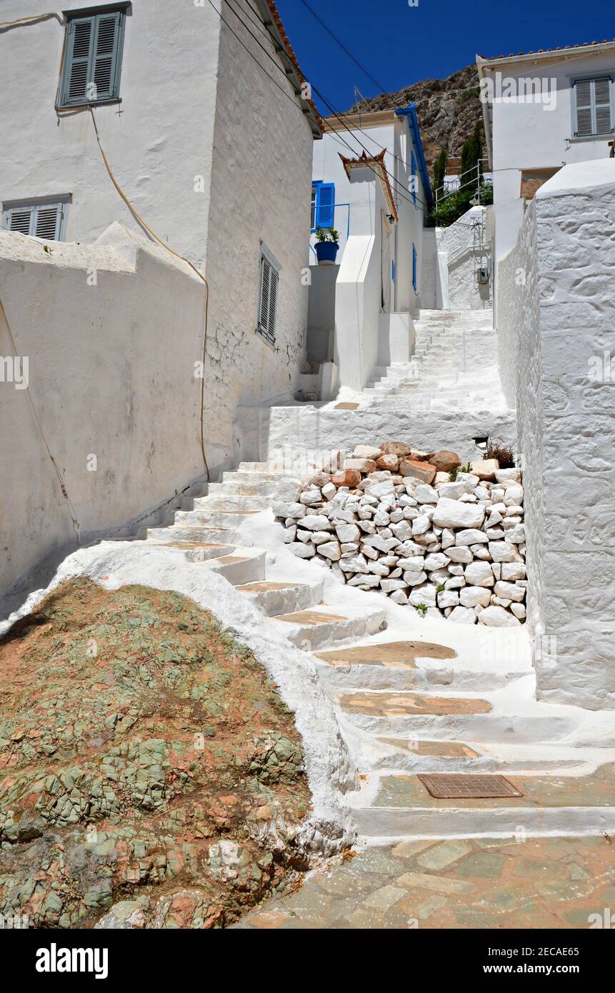 Traditional narrow whitewashed stone steps leading to the picturesque ...