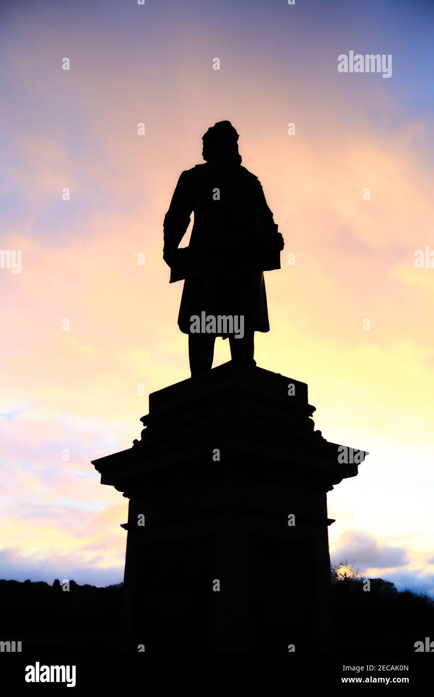 A statue of Sir Titus Salt standing in Robert's Park, part of Saltaire ...