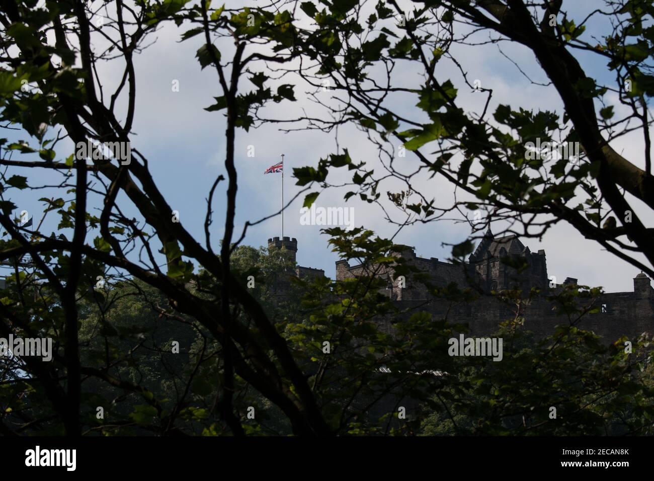 Edinburgh Castle, Edinburgh, Scotland. Framed by trees and seen from ...