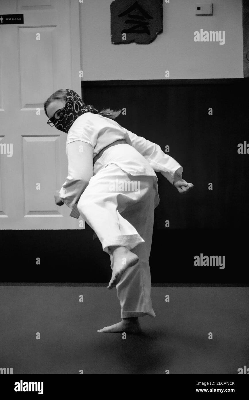 This action photo is of my daughter in her Karate class. Karate is a ...