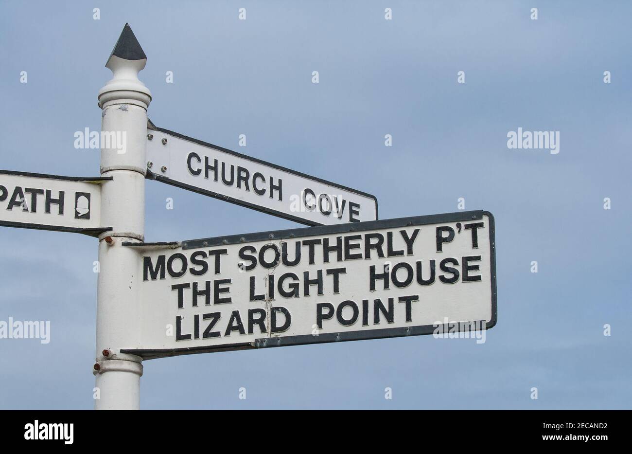 Road sign in Lizard village on the Lizard Peninsula, Cornwall. Pointing ...