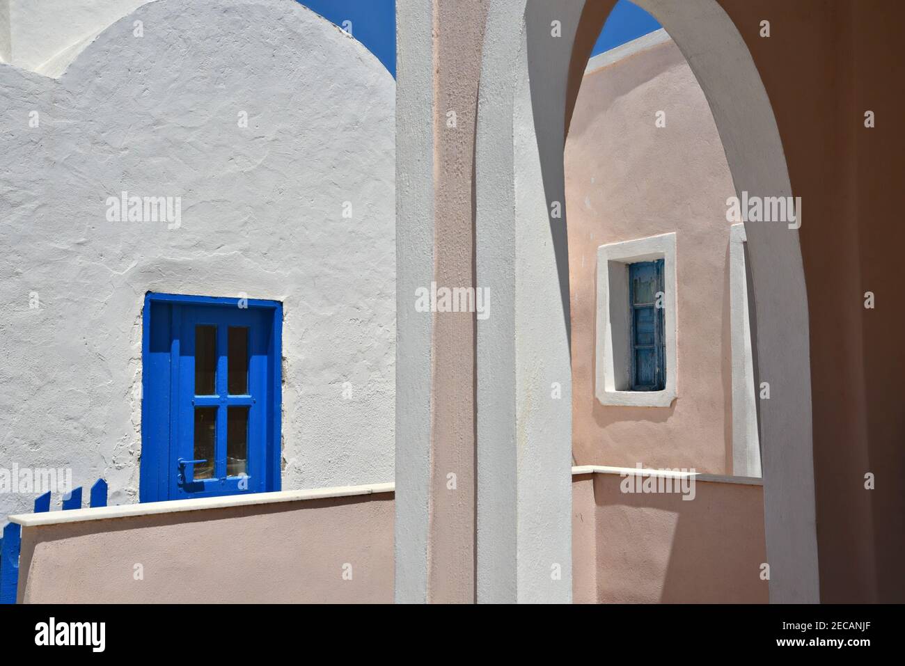 Traditional rural house facade with whitewashed arched walls and blue ...