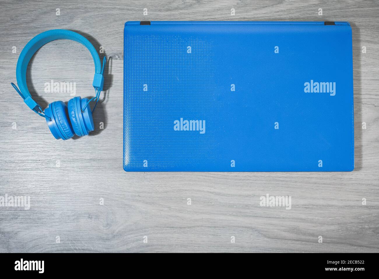 Office desk from above. laptop and headphones in blue color on wooden ...