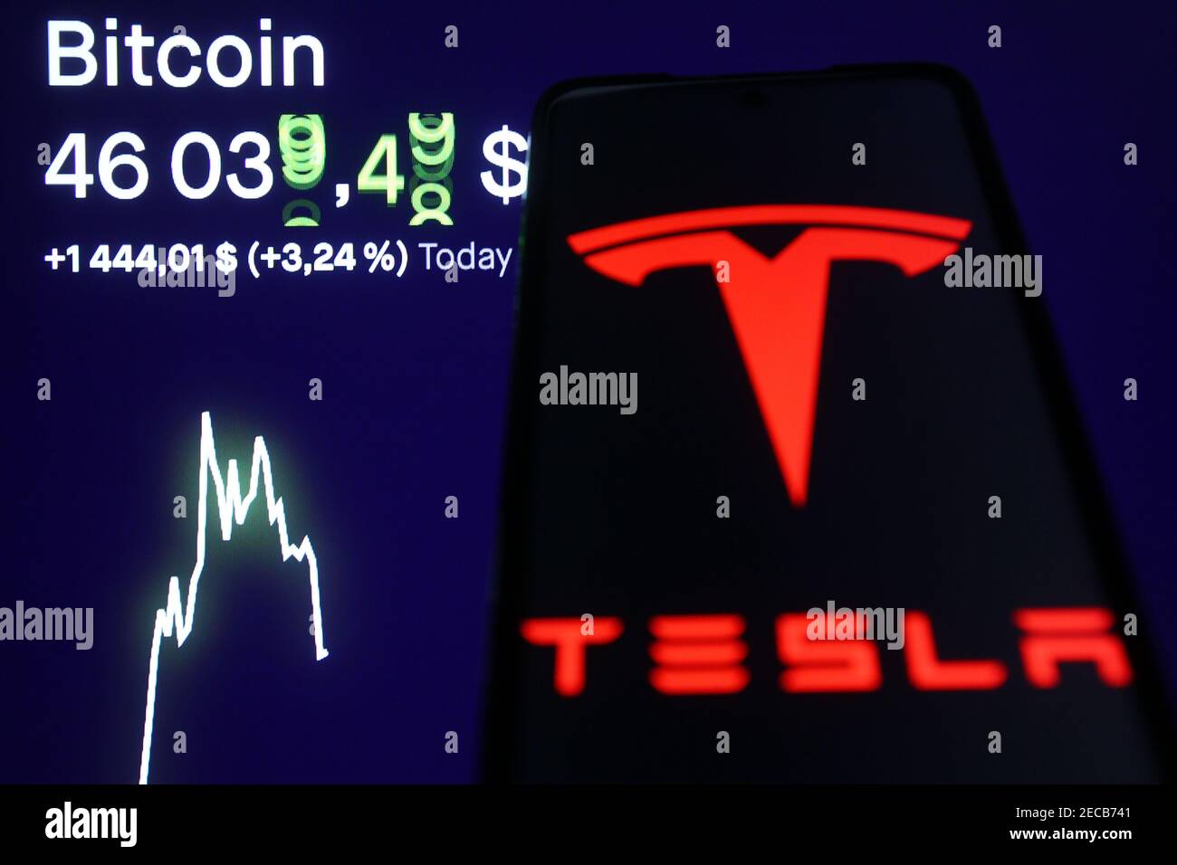 In this photo illustration a Tesla logo is seen on a mobile phone in ...