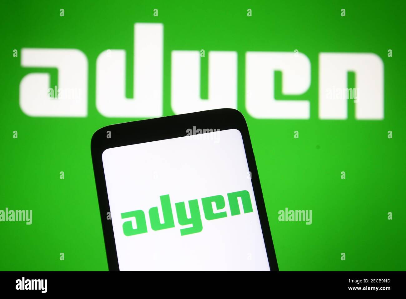 In this photo illustration an Adyen logo of a payment company is seen on a mobile phone screen ...