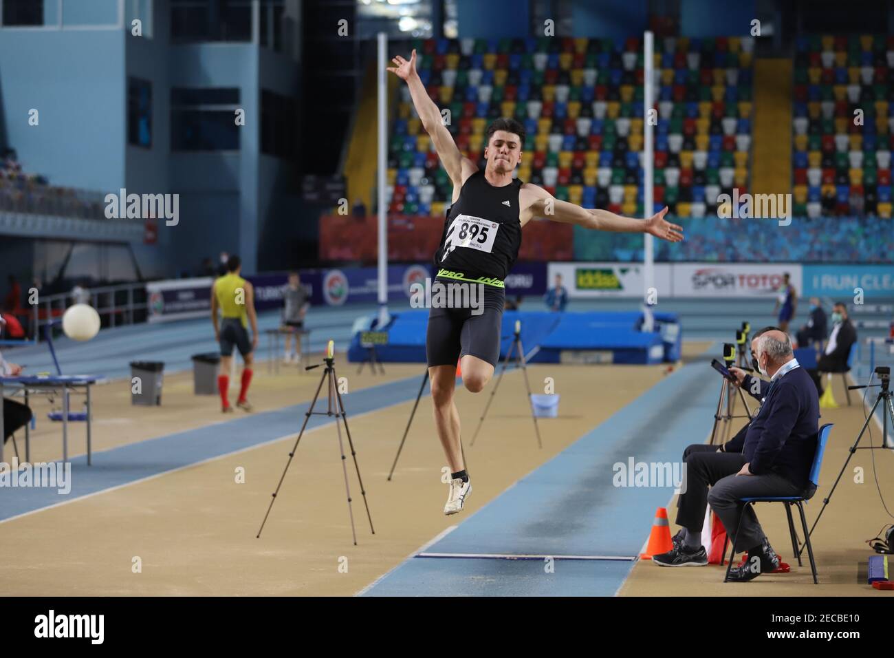 ISTANBUL, TURKEY - FEBRUARY 06, 2021: Undefined athlete long jumping ...