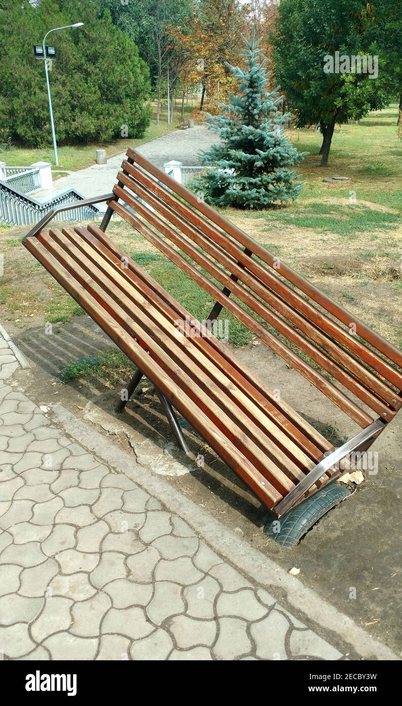 Balance bench in a city park Stock Photo - Alamy