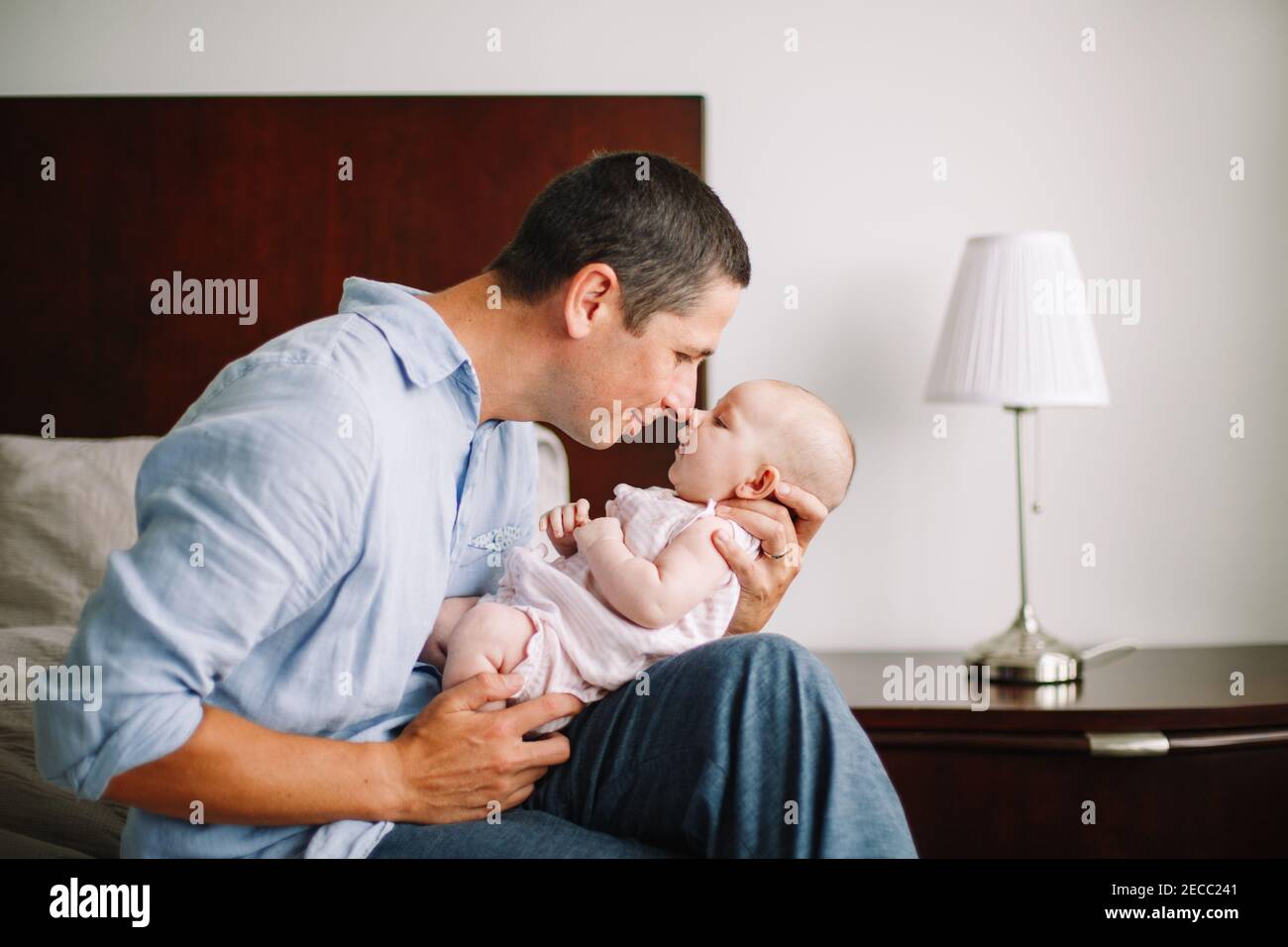 Fathers Day holiday. Middle age Caucasian father hugging and kissing ...