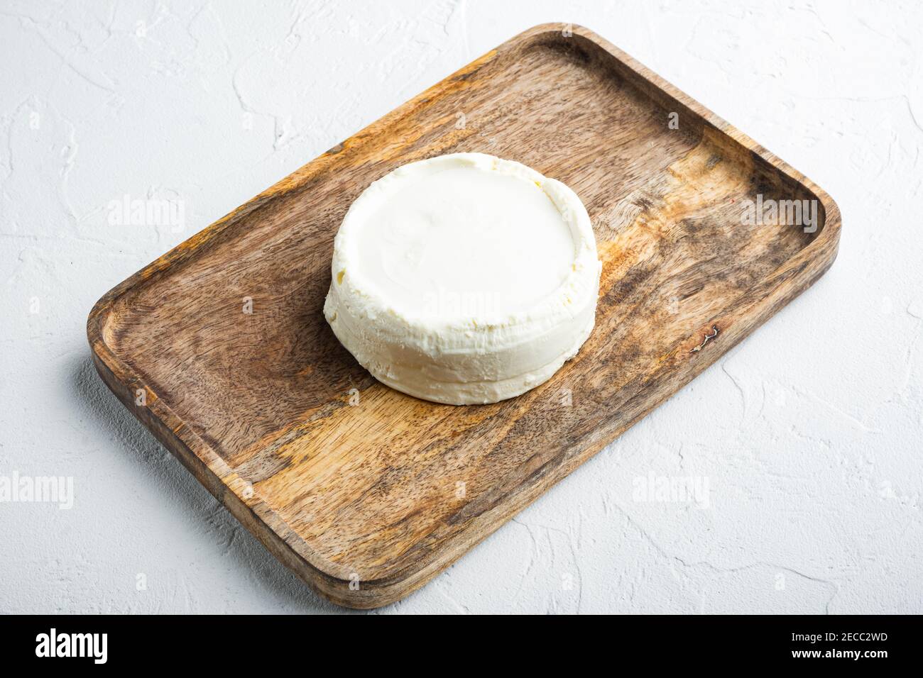Whole fresh, ricotta cheese, on white background Stock Photo - Alamy