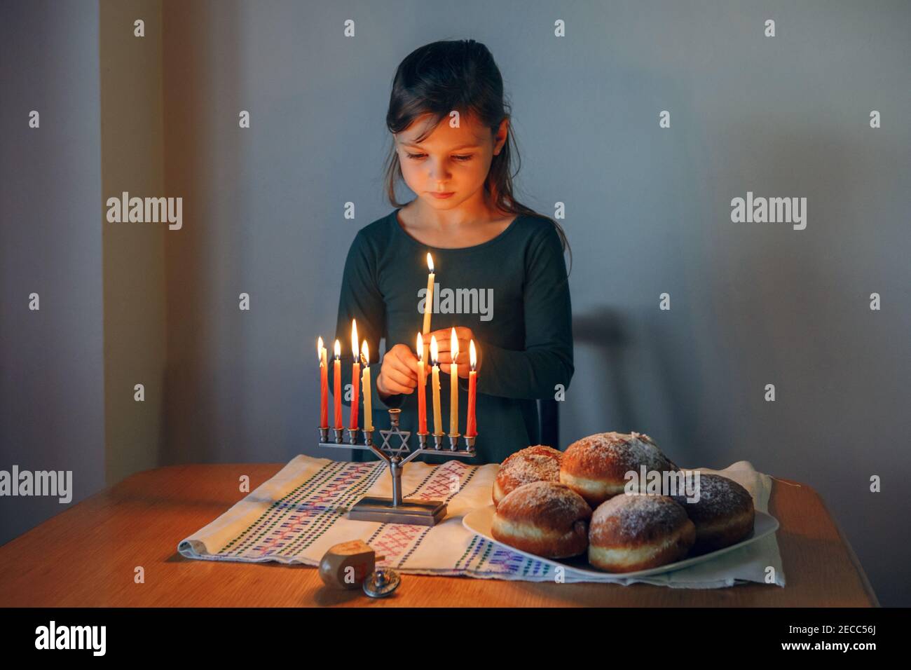 Child and menorah hi-res stock photography and images - Alamy