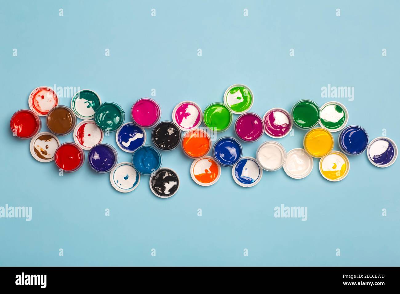 Acrylic paints of various colors for drawing are open on the table ...