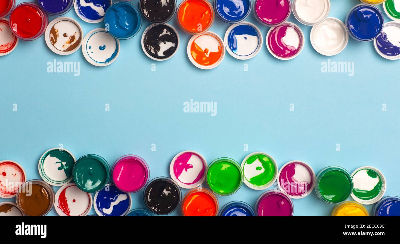 Acrylic paints of various colors for drawing are open on the table ...