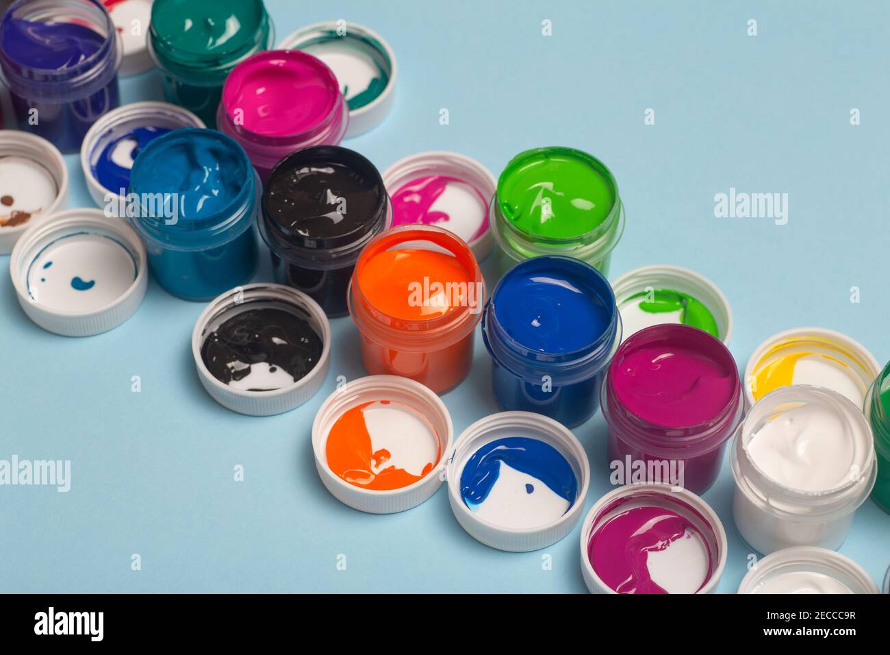 Acrylic paints of various colors for drawing are open on the table ...