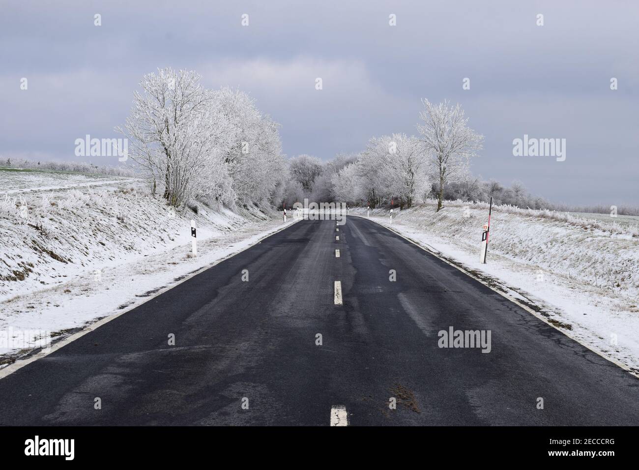 road through snow covered landscape in the Eifel Stock Photo - Alamy