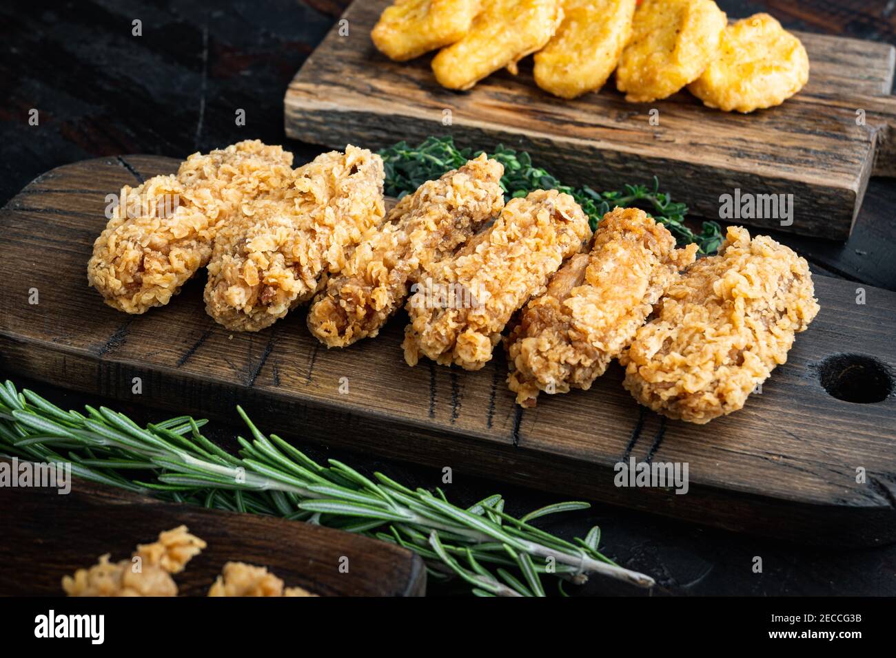Fried chicken wings parts on dark wooden background Stock Photo - Alamy