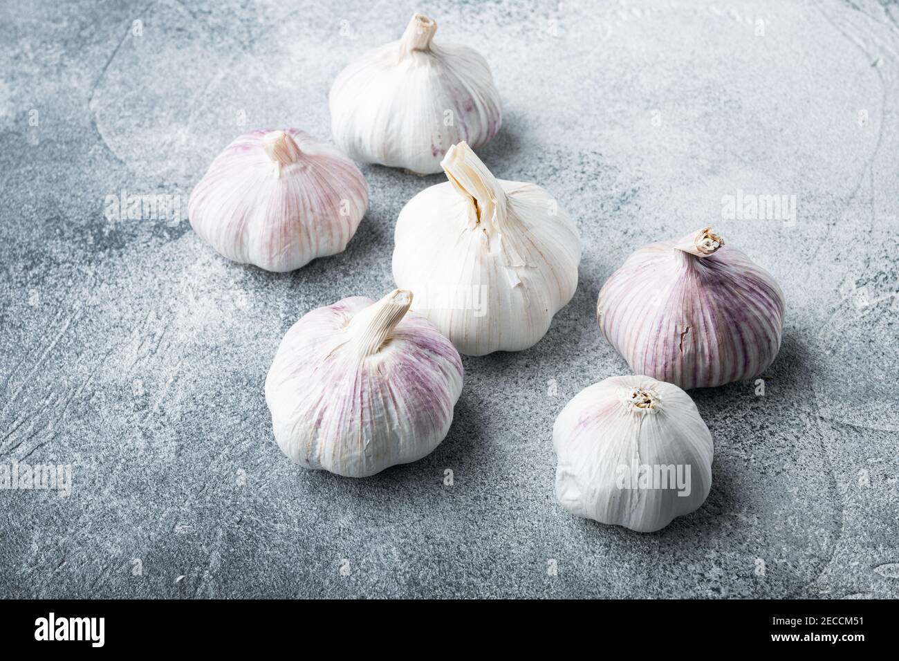 Pile of organic farm garlic set, on gray background Stock Photo - Alamy