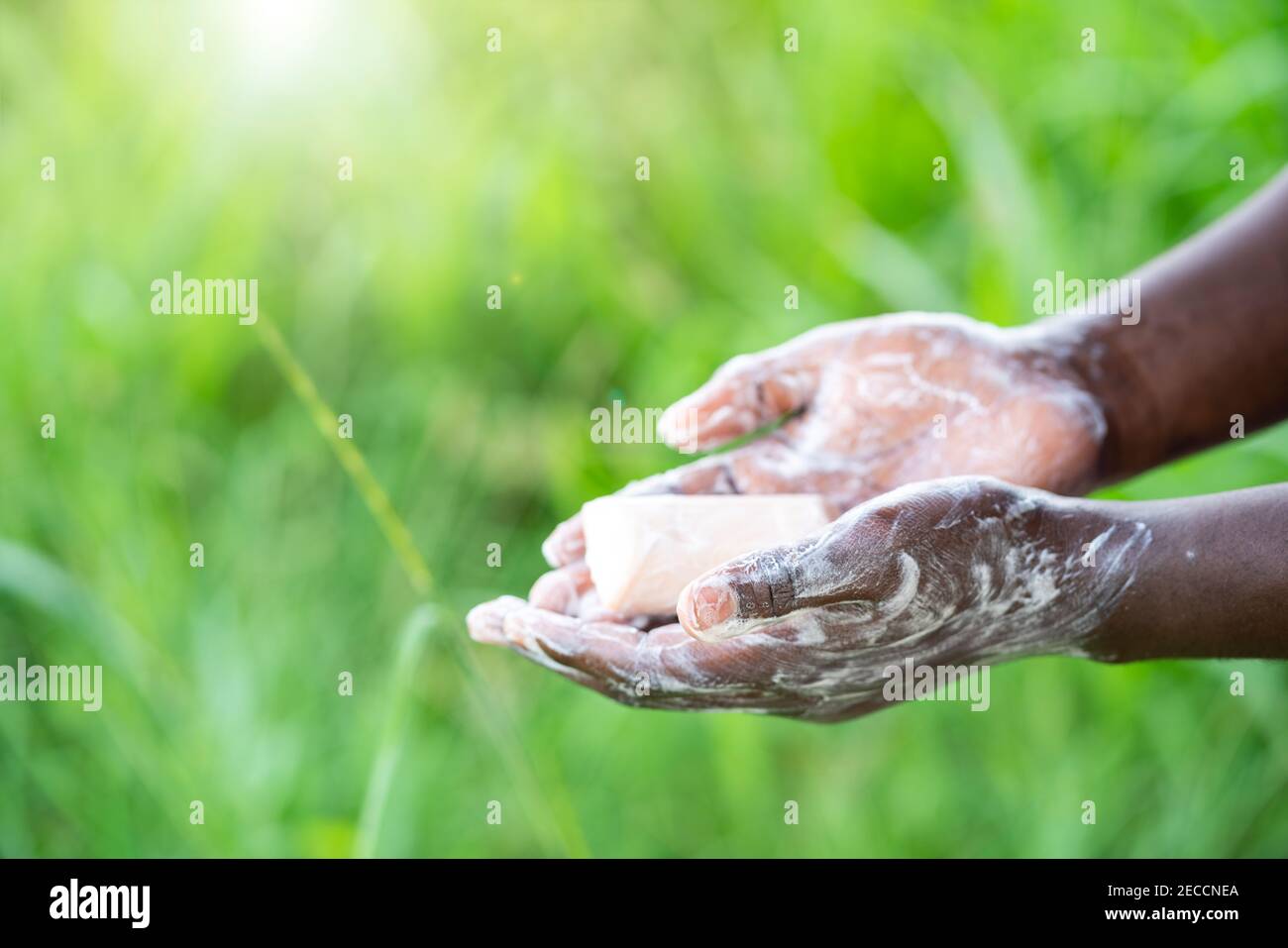 African man washing hands hi-res stock photography and images - Alamy