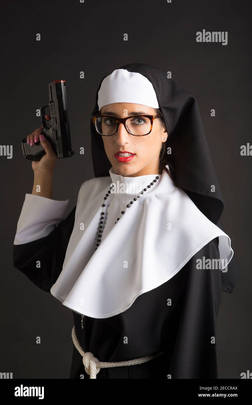 Portrait of a disguised nun on black background Stock Photo - Alamy