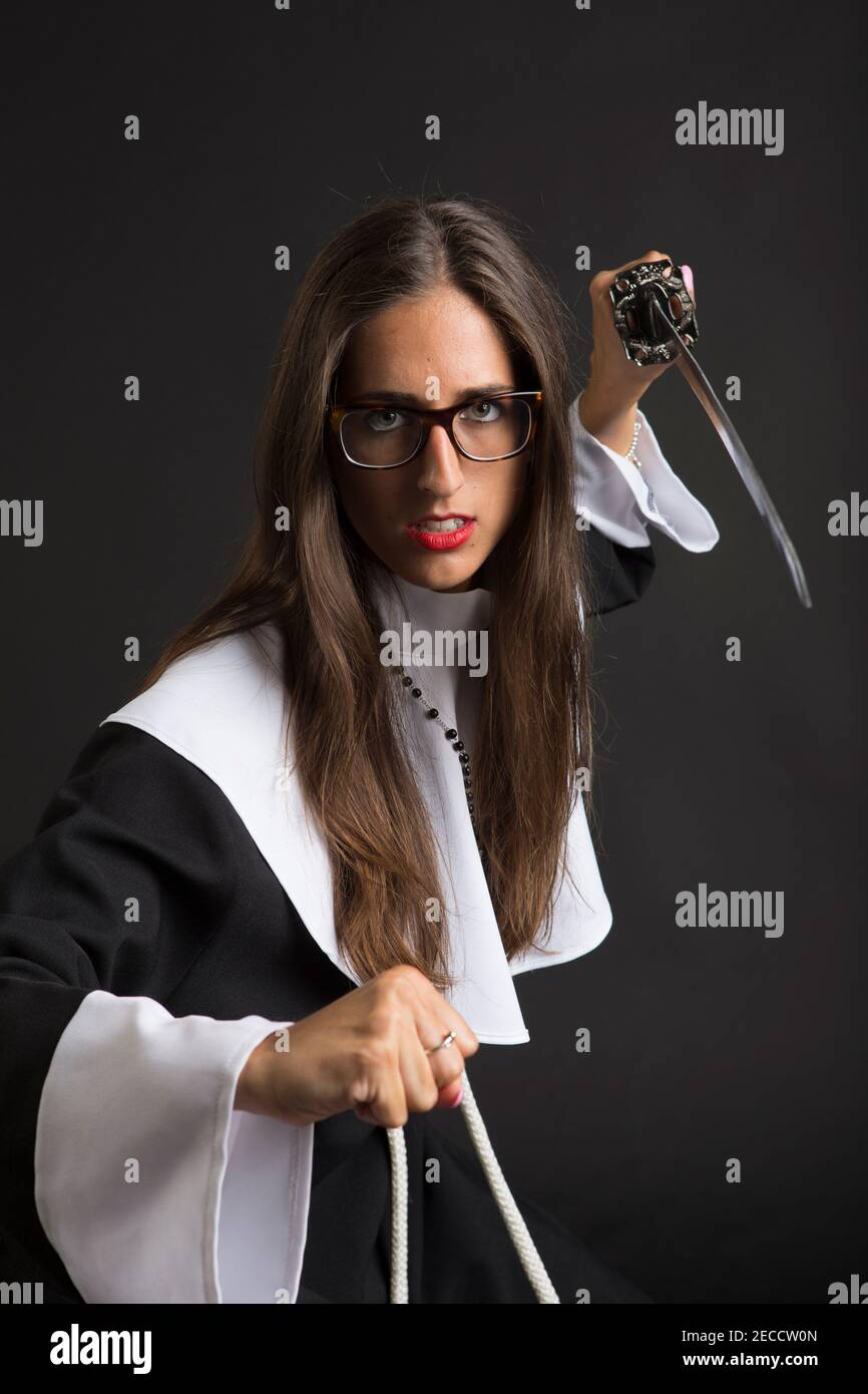 Portrait of a disguised nun on black background Stock Photo - Alamy