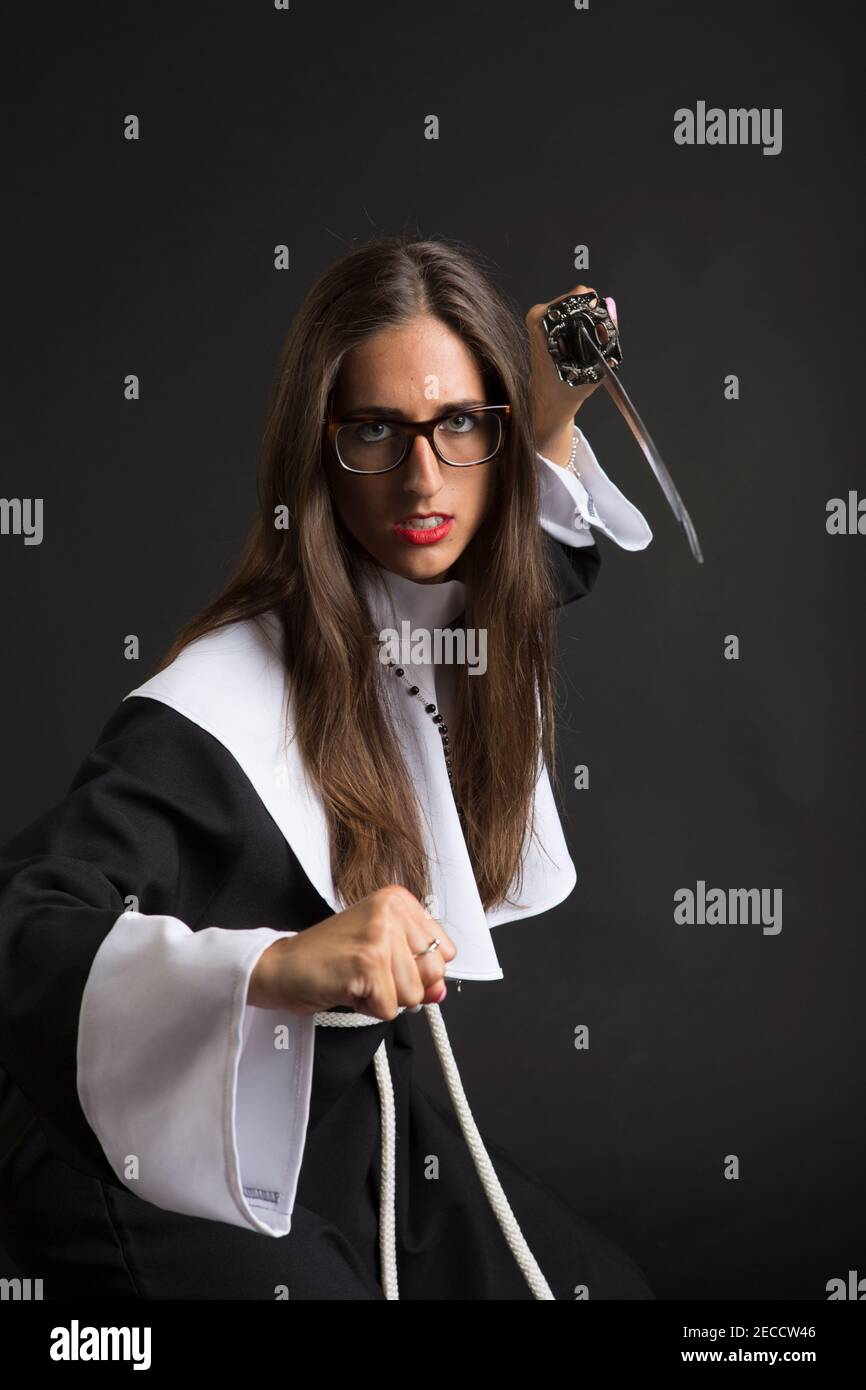 Portrait of a disguised nun on black background Stock Photo - Alamy