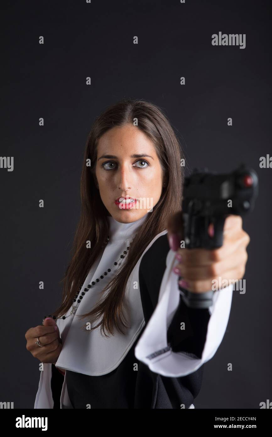 Portrait of a disguised nun on black background Stock Photo - Alamy