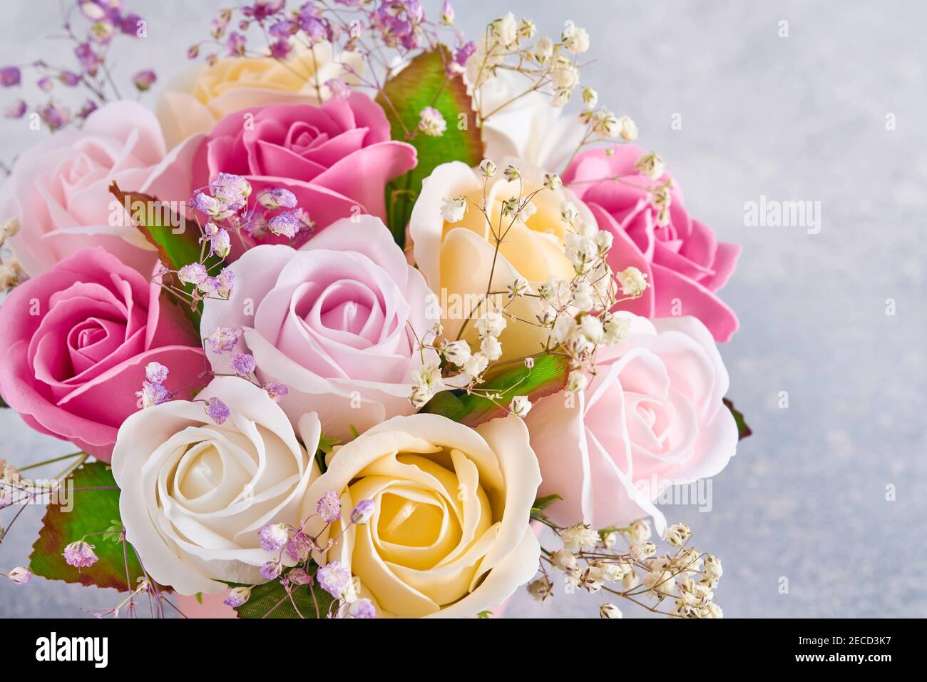 Festive composition with beautiful delicate roses flowers in pink round ...