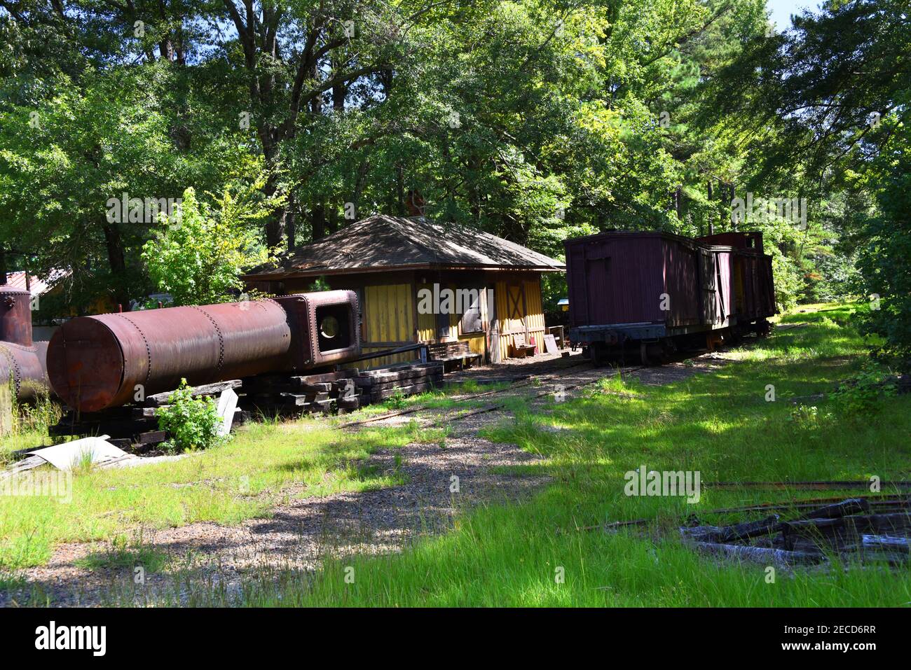 Rundown station, train parts and two railroad cars, are all that remain ...