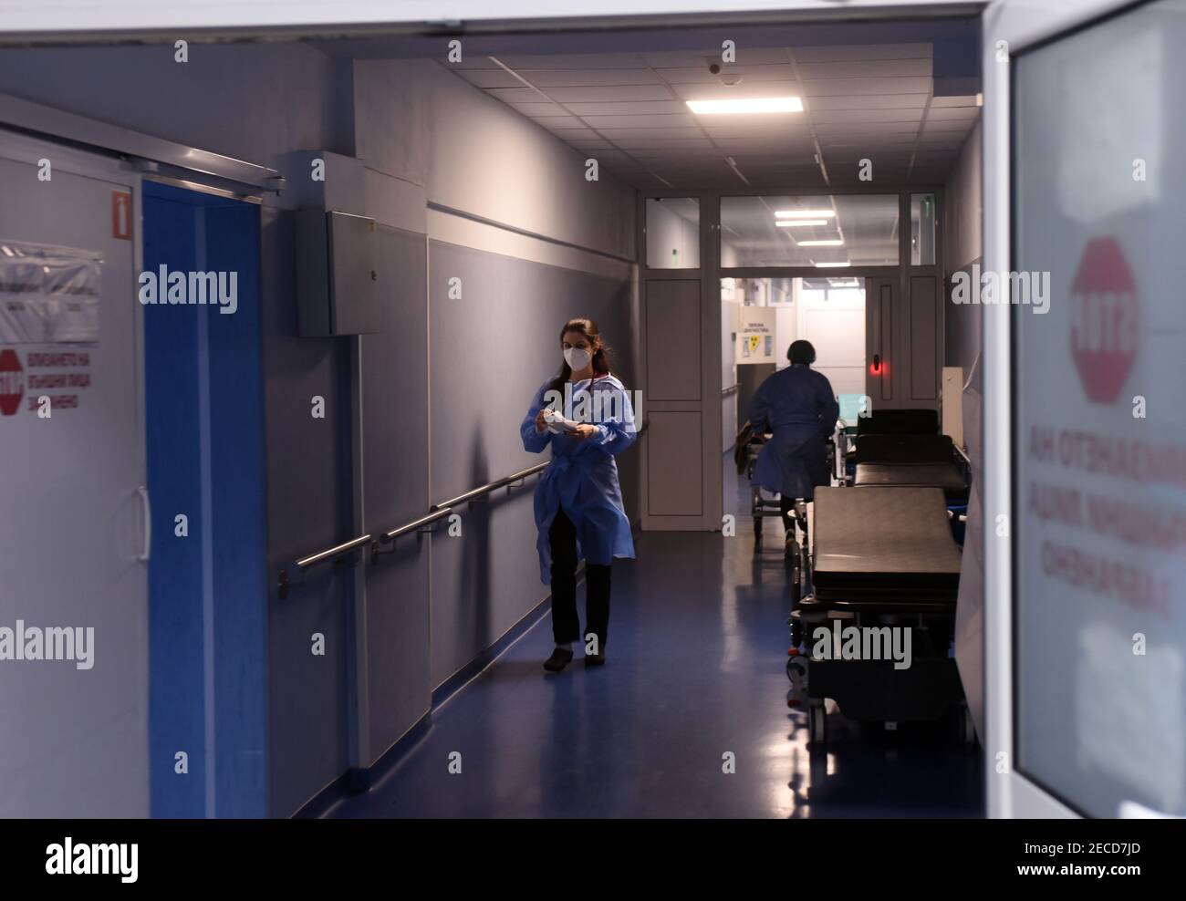 Sofia, Bulgaria - A nurse in protective mask is walking across a ...