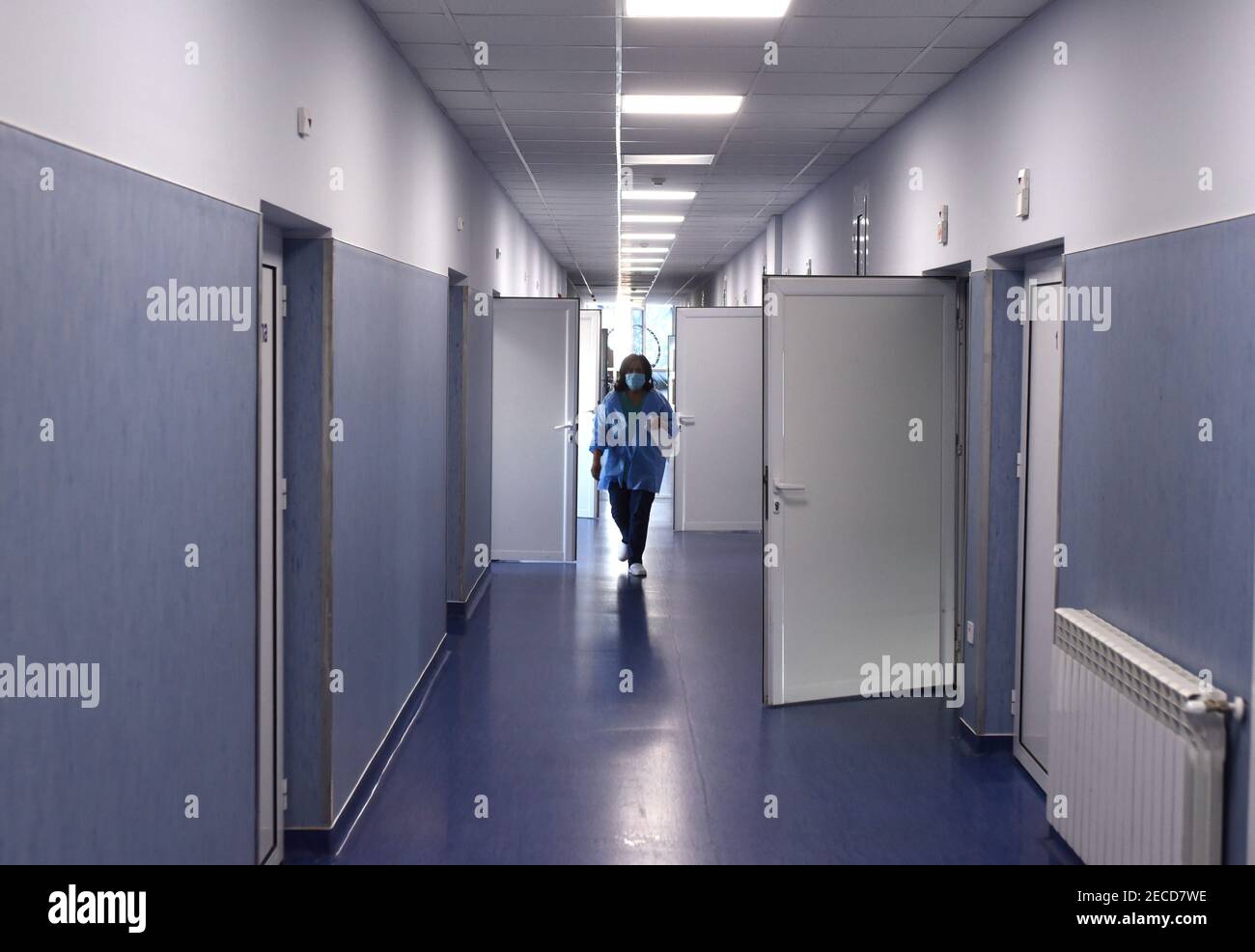 Sofia, Bulgaria - A nurse in protective mask is walking across a ...