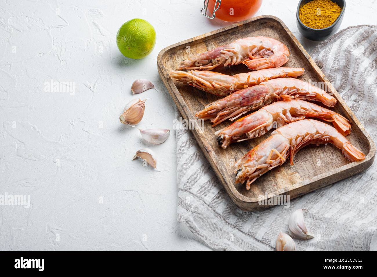 Raw red Argentinian prawns set, on wooden tray, on white background ...